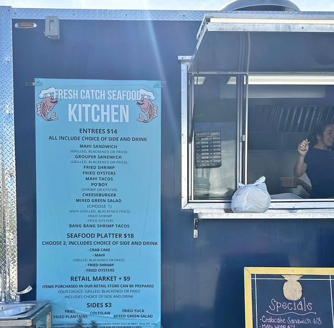 Where the magic happens! The food truck window where seafood dreams come true and locals line up for their fix.