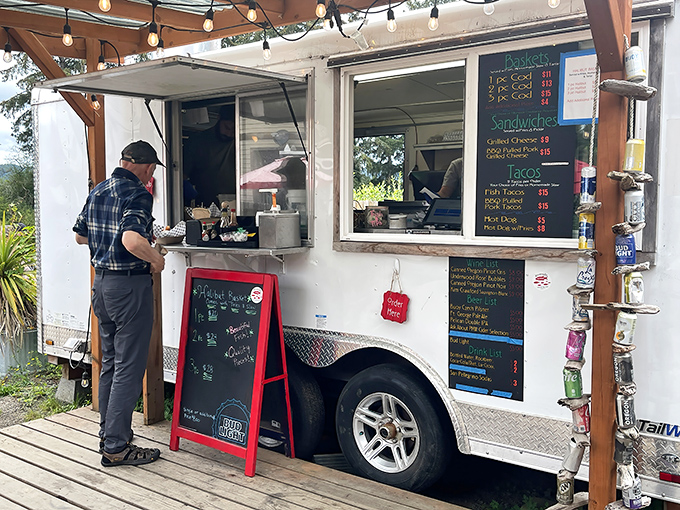 The food truck window&mdash;where culinary magic happens with minimal fuss and maximum flavor, proving great seafood needs no marble countertops.
