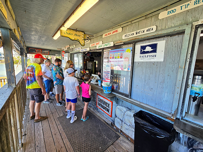 The order window &ndash; where dreams come true and diets go to die. Notice how nobody's checking their phone while waiting for their number to be called.