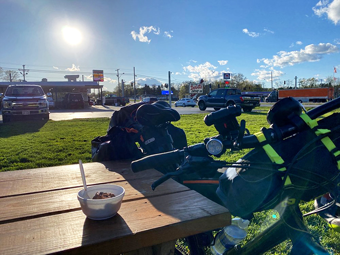 Outdoor dining where motorcycles and milkshakes create the perfect symphony of American summer afternoons.