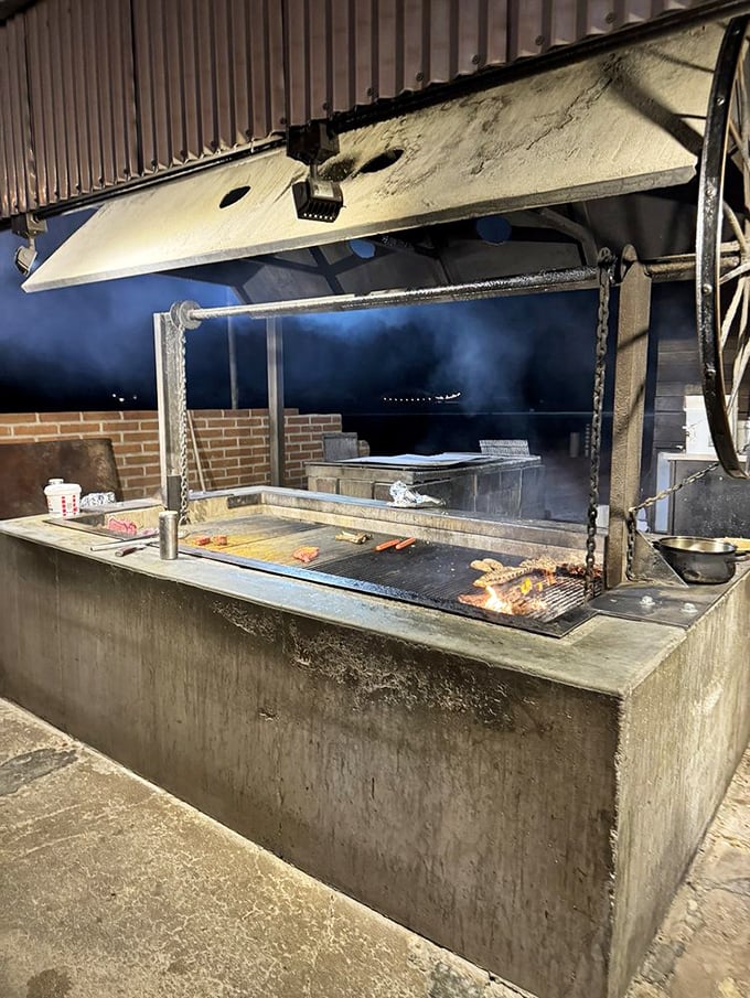 The beating heart of Li'l Abner's &ndash; an outdoor pit where smoke, fire, and skill transform good meat into something that haunts your dreams.