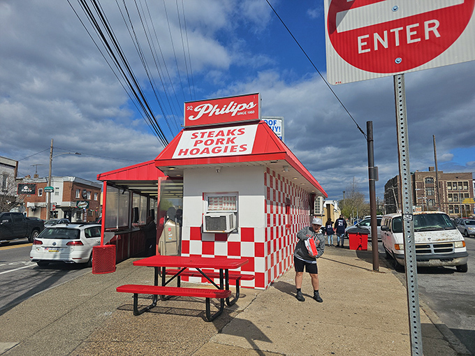 The red and white checkerboard exterior isn't trying to be Instagram-worthy&mdash;it just naturally is. Outdoor seating for sandwich contemplation.