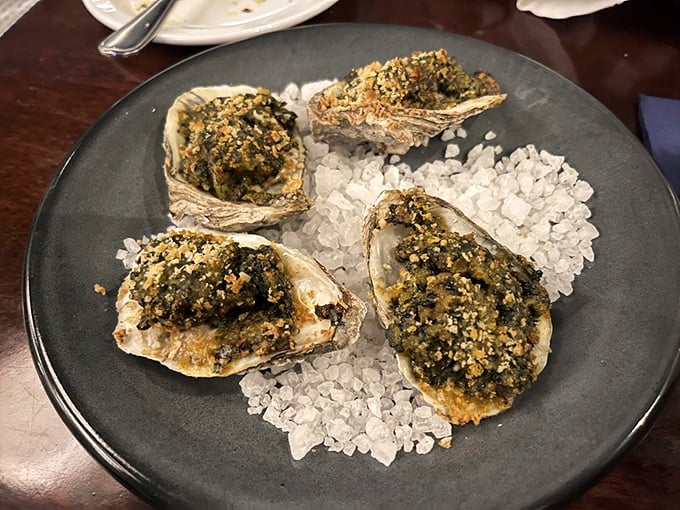 Oysters Rockefeller&mdash;where bivalves dress in their Sunday best. That herb-and-breadcrumb topping is like a tiny green tuxedo for each delicious morsel.