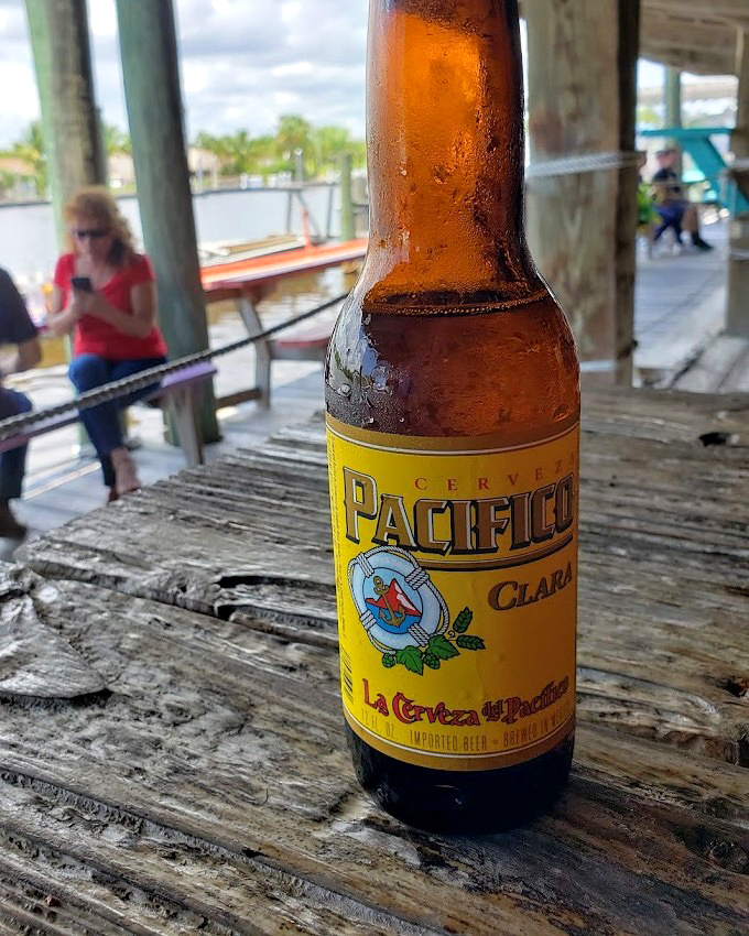 Nothing complements seafood like an ice-cold Pacifico with a view of the water. The condensation on the bottle mirrors the sweat on your brow.