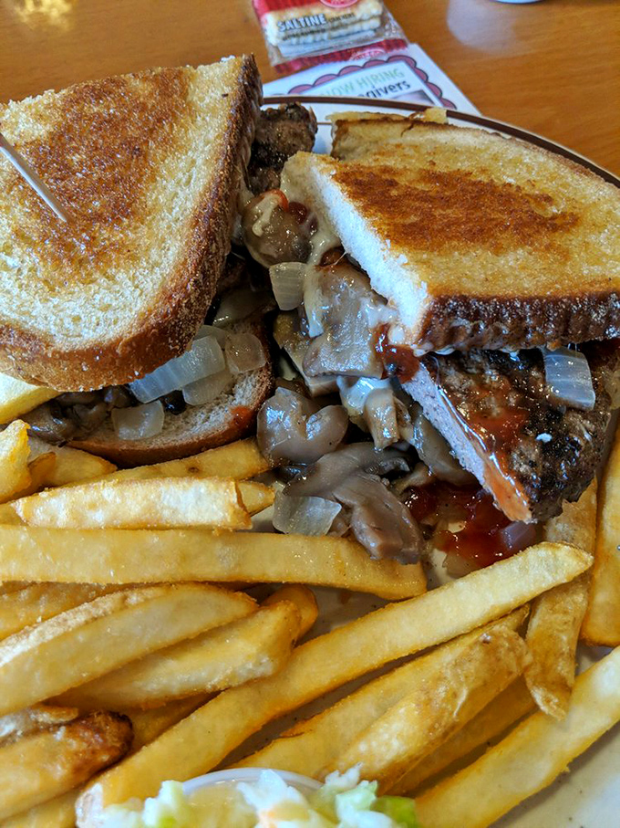 The patty melt&mdash;that perfect marriage of burger and grilled cheese&mdash;flanked by golden fries that practically beg to be stolen.