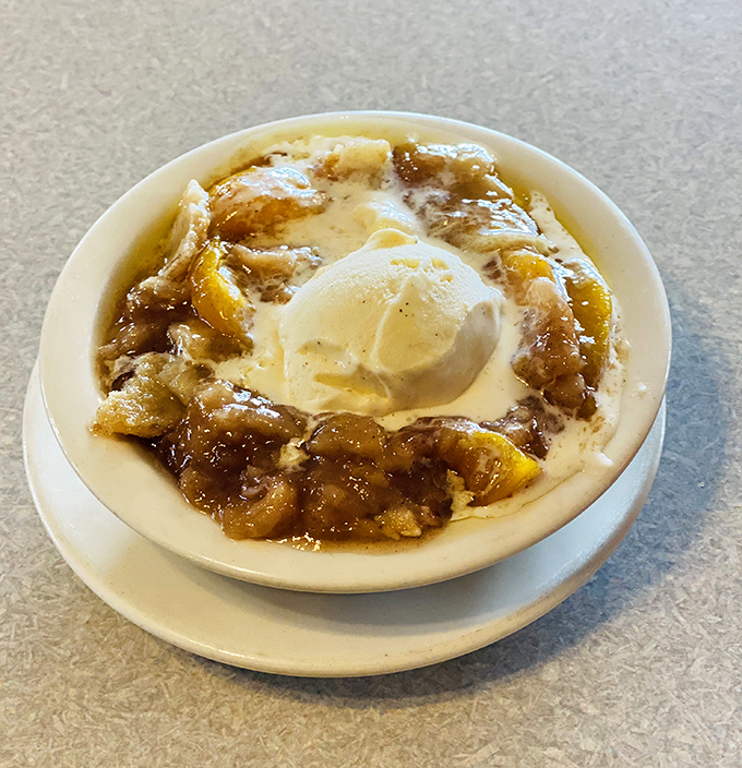 This isn't just peach cobbler with ice cream&mdash;it's what happiness would look like if it took physical form and landed in a bowl.