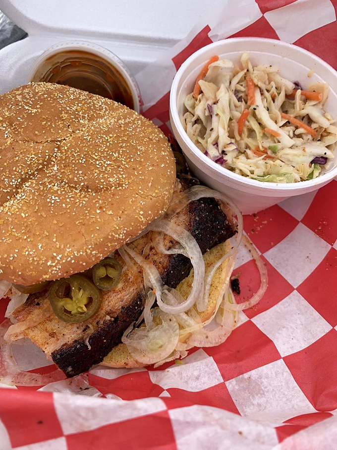 The coleslaw provides the perfect crisp counterpoint to this sandwich's main event&mdash;a glorious stack of meat with pickles and onions.