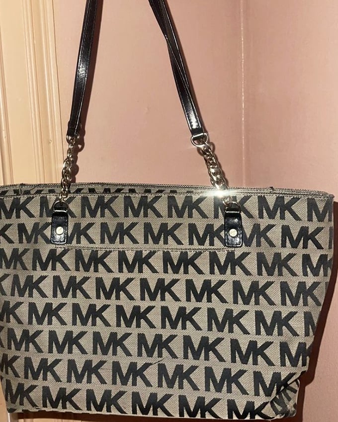Designer bags at non-designer prices. This Michael Kors tote probably cost less than the lunch its previous owner had after buying it new.