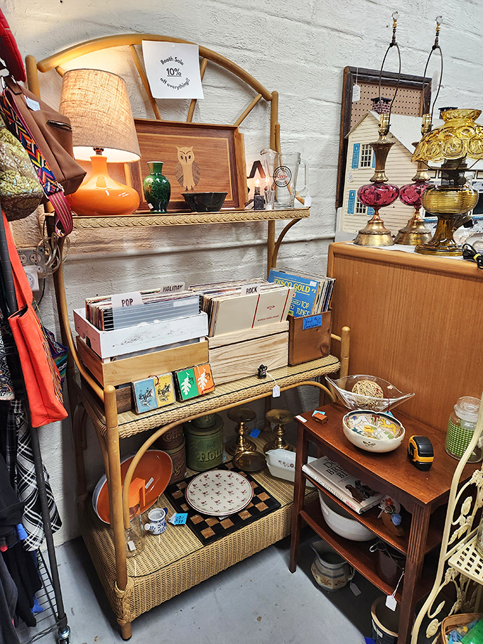 Mid-century modern meets wicker charm in this cozy corner. That orange lamp could tell tales of living rooms past and cocktail parties long forgotten.