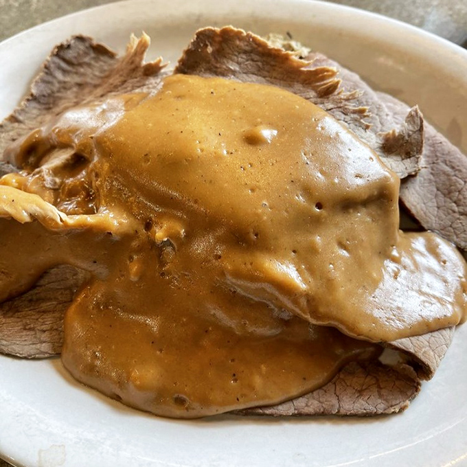 Roast beef so tender it practically sliced itself, swimming in gravy that could make cardboard taste gourmet. Pure comfort on a plate.