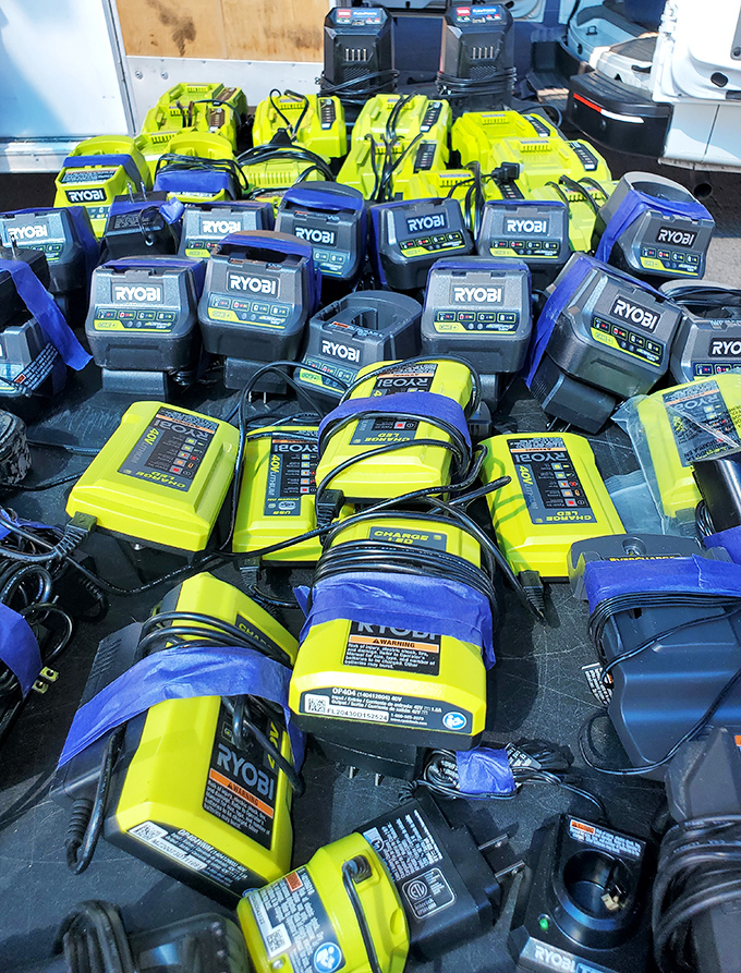 Tool heaven for DIY enthusiasts! This sea of Ryobi chargers and batteries would make Tim Allen grunt with pure delight.