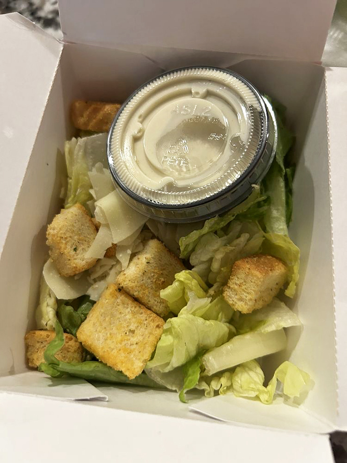 Even salads get the royal treatment here. Crisp lettuce, crunchy croutons, and dressing on the side&mdash;a nod to those of us pretending to be virtuous.