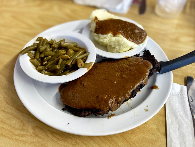 Soul food royalty: Salisbury steak smothered in rich gravy with green beans that would make your grandmother nod in approval.