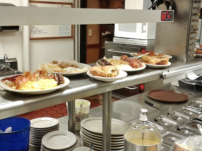 Where breakfast magic happens &ndash; plates lined up at the pass like performers waiting for their cue to wow the audience.
