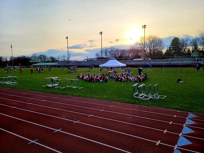 Community gatherings at Shikellamy Stadium bring residents together under spectacular sunset skies, where small-town spirit shines brighter than stadium lights.