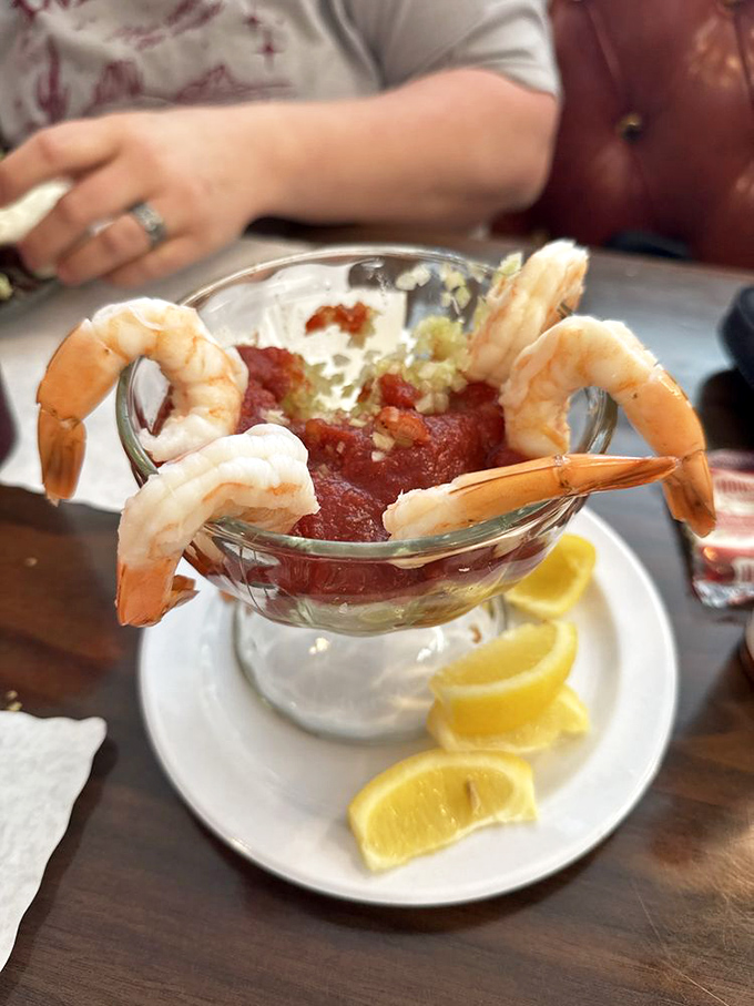 Plump shrimp perched proudly around a zesty cocktail sauce &ndash; like synchronized swimmers showing off around a spicy pool.