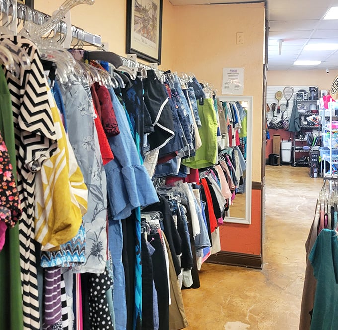 A rainbow of fabrics tells stories of vacations past and adventures future. That mirror knows the truth: everything looks better when it's a bargain.