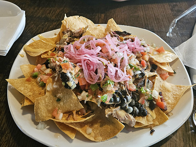 Smokehouse nachos loaded with pulled pork prove that fusion food can be both ridiculous and absolutely brilliant.