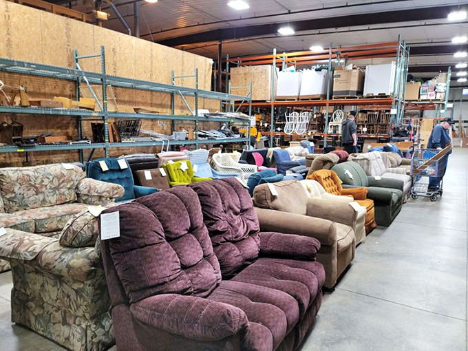 The sofa section—where recliners and loveseats sit like patient dogs at the shelter, eyes saying, "Take me home, I promise to be comfortable!"