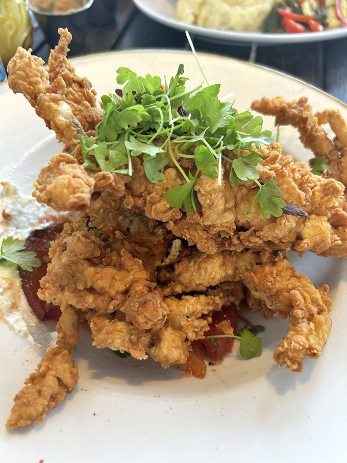 Soft shell crab that's been given the royal treatment&mdash;crispy, golden, and topped with microgreens that add both color and bragging rights.