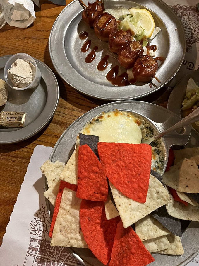 Spinach artichoke dip with tri-color tortilla chips&mdash;the kind of appetizer that ruins friendships when someone takes the last scoop.