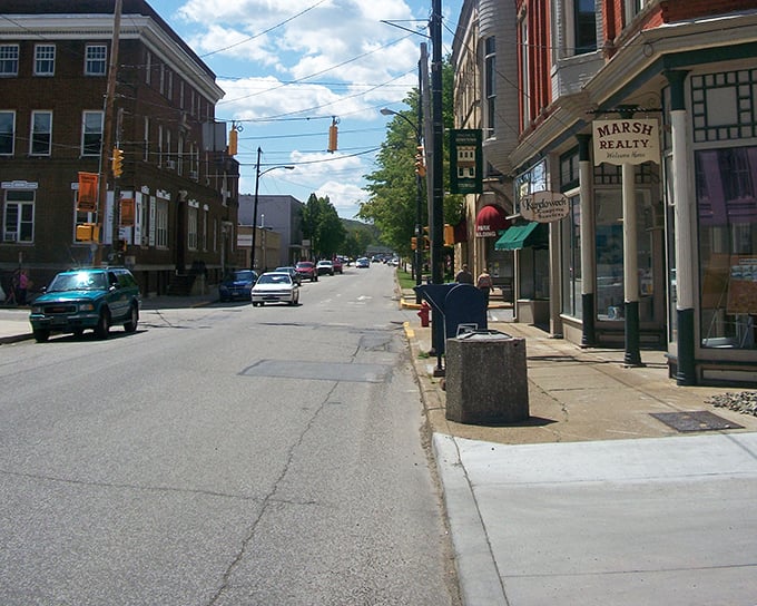 Motorcycles lined up outside colorful storefronts create that perfect small-town tableau where Americana meets unexpected pops of pink and blue.