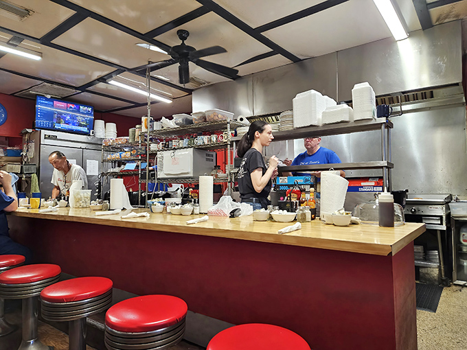 The culinary orchestra at work. When these folks are cooking, you're not just getting breakfast&mdash;you're getting decades of experience on a plate.
