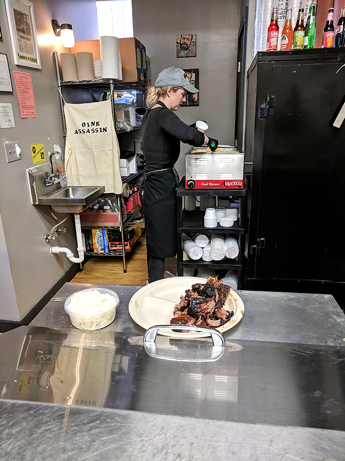 Behind the scenes where the magic happens. That apron says "Oink Assassin"&mdash;a job title that deserves both respect and gratitude.