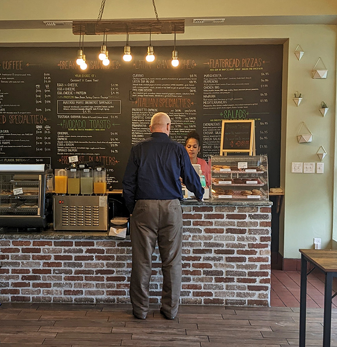 The sacred exchange of sandwich wisdom happens daily at this counter, where dreams are built between slices.