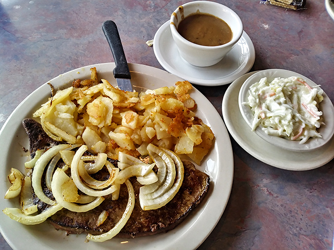 When home fries upstage a perfectly cooked steak, you know you're in potato heaven. That cup of gravy is the supporting actor.