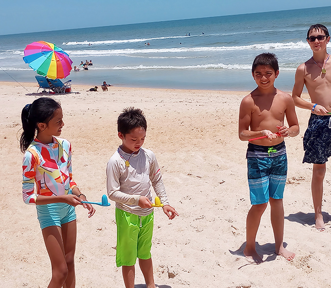 Beach days are memory factories. These kids are busy creating the "remember when" stories they'll be telling for decades to come.