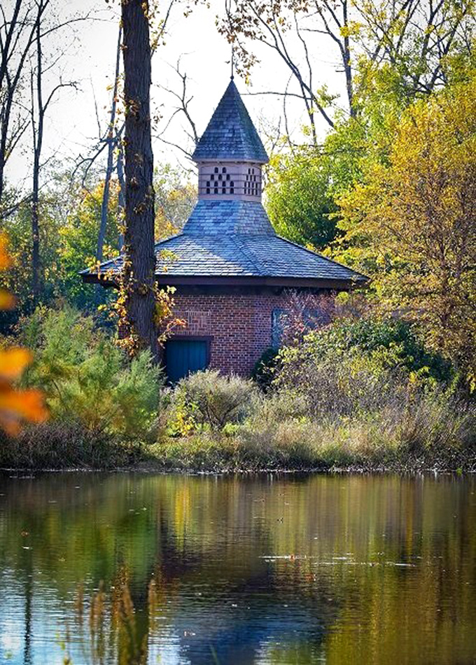The charming Dove Cote stands like a storybook illustration come to life, its reflection doubling the magic on calm water days. 
