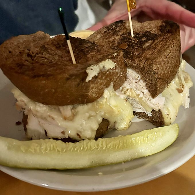 The Turkey Reuben proves that even poultry can achieve sandwich greatness when paired with melty cheese and tangy sauerkraut. A lighter classic.