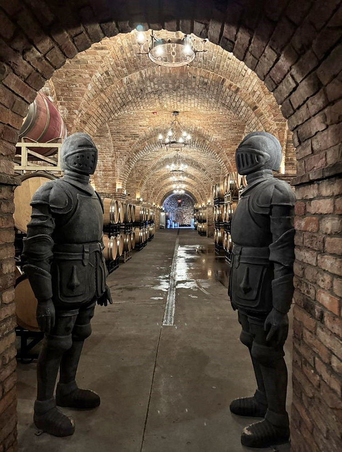 Knights stand eternal guard over aging wine barrels in this atmospheric cellar, ensuring no thirsty peasants make off with the precious cargo.