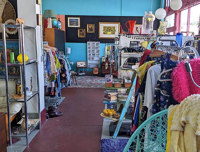 A color-drenched aisle where vintage clothing meets retro decor in a dance of decades that somehow makes perfect sense together.