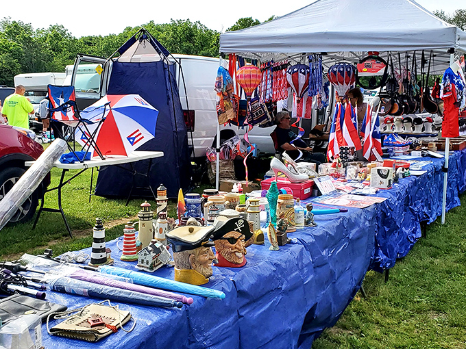 Maritime meets whimsy at this eclectic booth, where lighthouse figurines share space with flags and the promise of coastal charm.