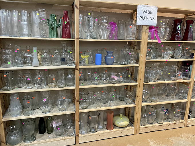 The vase collection rivals a small museum. That green glass cactus would make even your sad office succulent look like intentional d&eacute;cor.