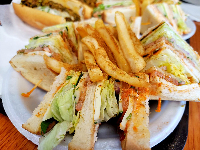 This club sandwich and fries combo got dressed up for the occasion. The dusting of spices is like putting a tuxedo on comfort food.