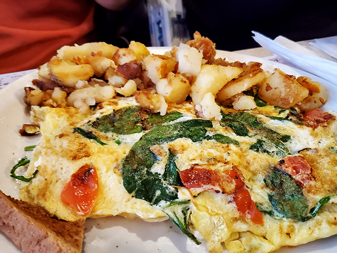 This veggie omelet proves that healthy can be indulgent too. Spinach, tomatoes, and potatoes combine for a breakfast that's both virtuous and delicious.