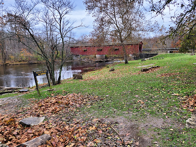 Autumn transforms the scene into a painter's palette, with fallen leaves creating nature's welcome mat to this historic treasure.