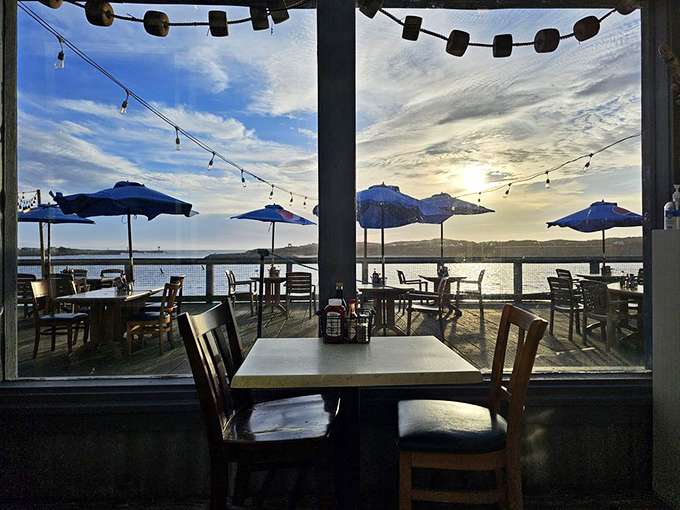 Dining with a view that makes you wonder why you ever eat indoors. Those string lights aren't decoration&mdash;they're setting the stage for seafood theater.