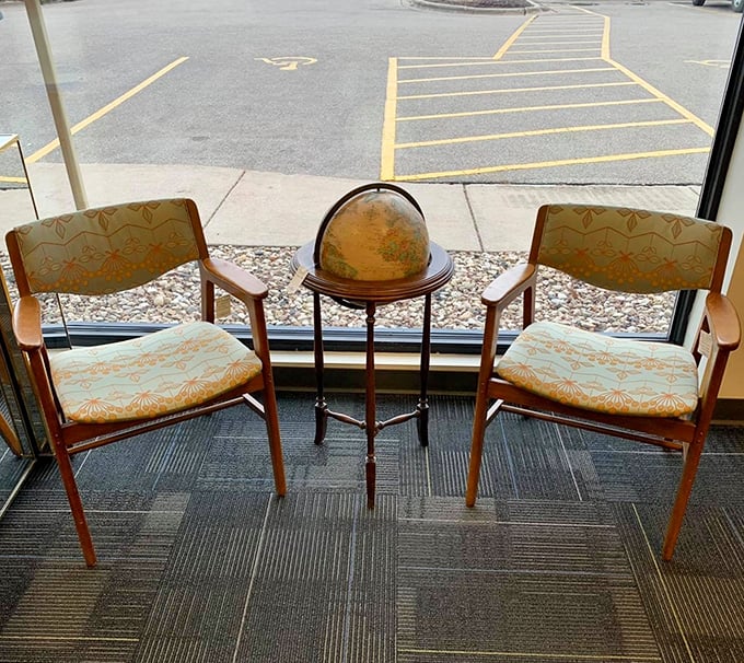 A worldly corner waiting for conversation. This vintage globe and chair setup whispers of adventures planned and stories shared over afternoon coffee.