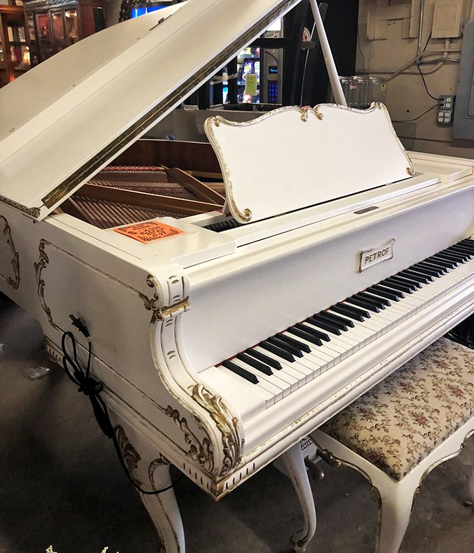 A white grand piano that's seen more elegant fingers than a manicurist. Imagine the conversations this would start in your living room!