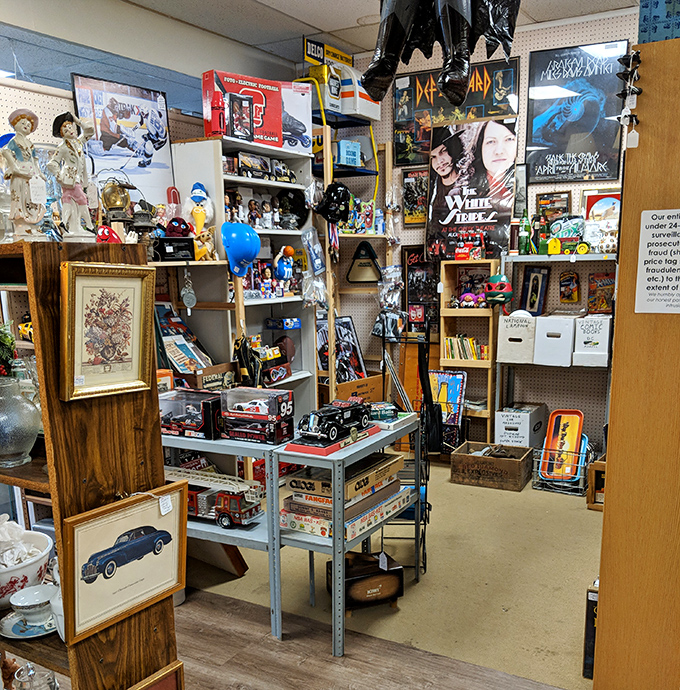 Rock history displayed vertically&mdash;Def Leppard to White Zombie posters create a timeline of concert memories and questionable teenage bedroom decor choices.