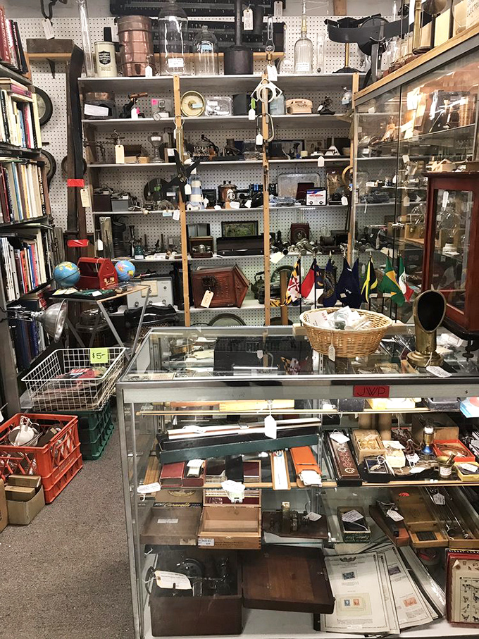 A collector's dream of vintage tools and gadgets. That display case holds more stories than your grandfather after his third bourbon.