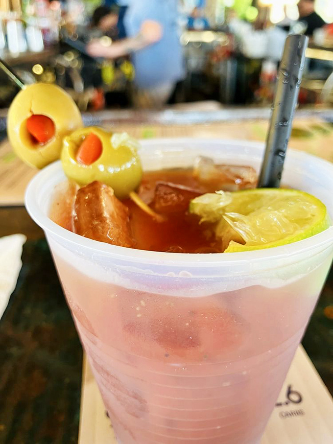 A Bloody Mary dressed for success with olives standing at attention. The perfect companion for watching boats drift by on a lazy afternoon.