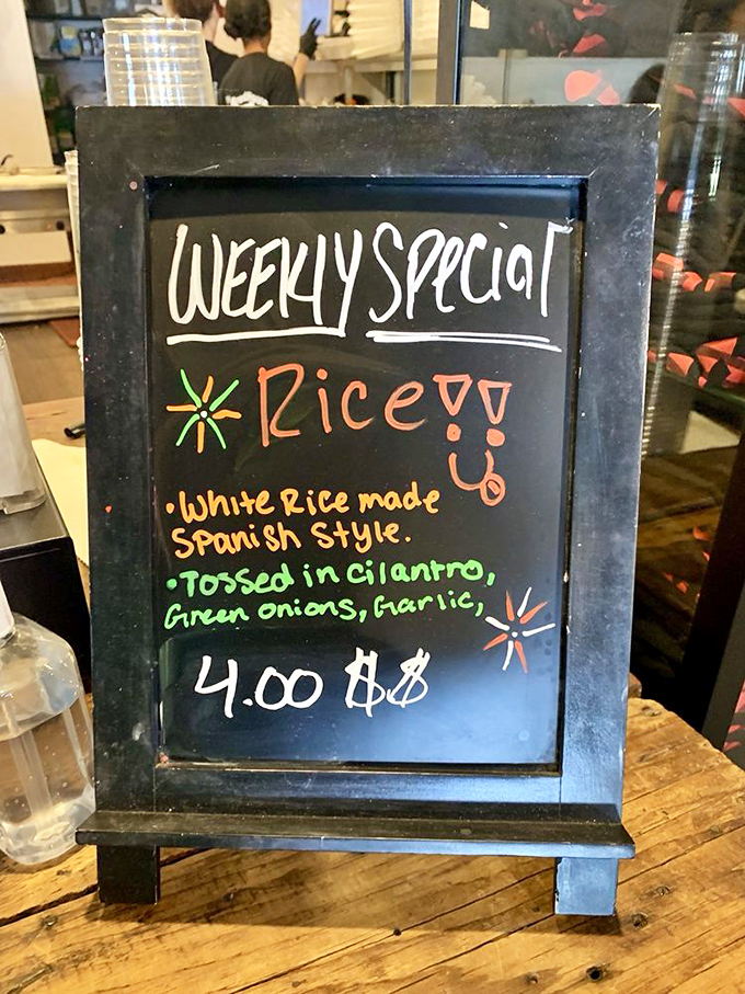 The weekly special board announces rice "Spanish style" with the enthusiasm of someone who knows they're about to make your day significantly better.