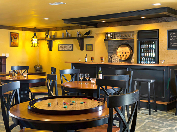 The Raven's Roost Pub offers games, libations, and merry company. That crokinole board has likely settled more friendly disputes than any royal decree.