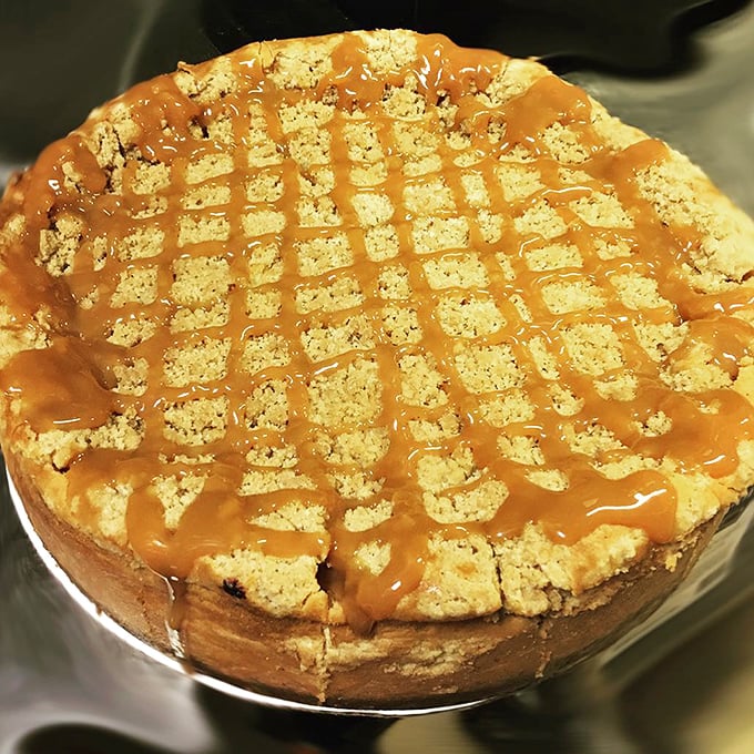 Apple caramel cheesecake with a lattice of sweet drizzle that would make your grandmother both jealous and proud.