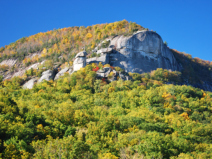 Granite cliffs draped in autumn finery &ndash; where every tree seems to be competing in nature's version of "Who Wore It Best?"